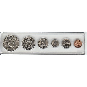 1973 BIRTH YEAR COIN SET- 6 COINS- EISENHOWER DOLLAR, KENNEDY HALF DOLLAR, QUARTER, DIME, NICKEL, AND CENT- ALL DATED 1973 AND DISPLAYED IN A HARD PLASTIC CASE- COINS ARE UNCIRCULATED