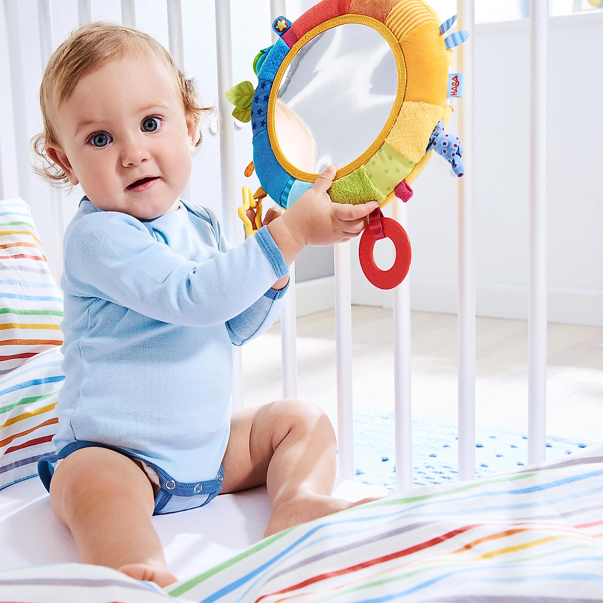 HABA Rainbow Discovery Mirror - Hang from Crib or Use as a Pillow with Entertaining Elements for Baby to Explore