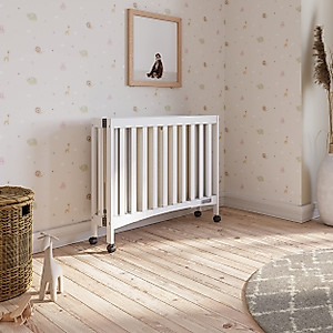 Child Craft London Mini Compact Folding Portable Crib with 2” Crib Mattress and 2 Easy Roll Locking Wheels, Durable Pine Wood Construction (Matte White)