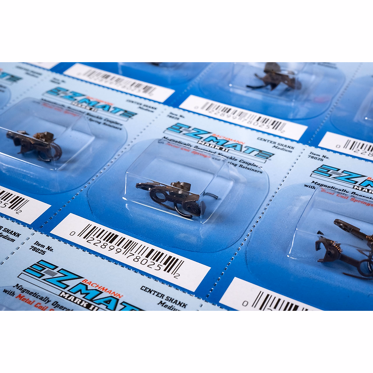 Bachmann Trains - E-Z MATE MARK II COUPLERS - MAGNETIC KNUCKLE COUPLERS with METAL COIL SPRING - CENTER SHANK - MEDIUM (12 pair/card) - HO Scale