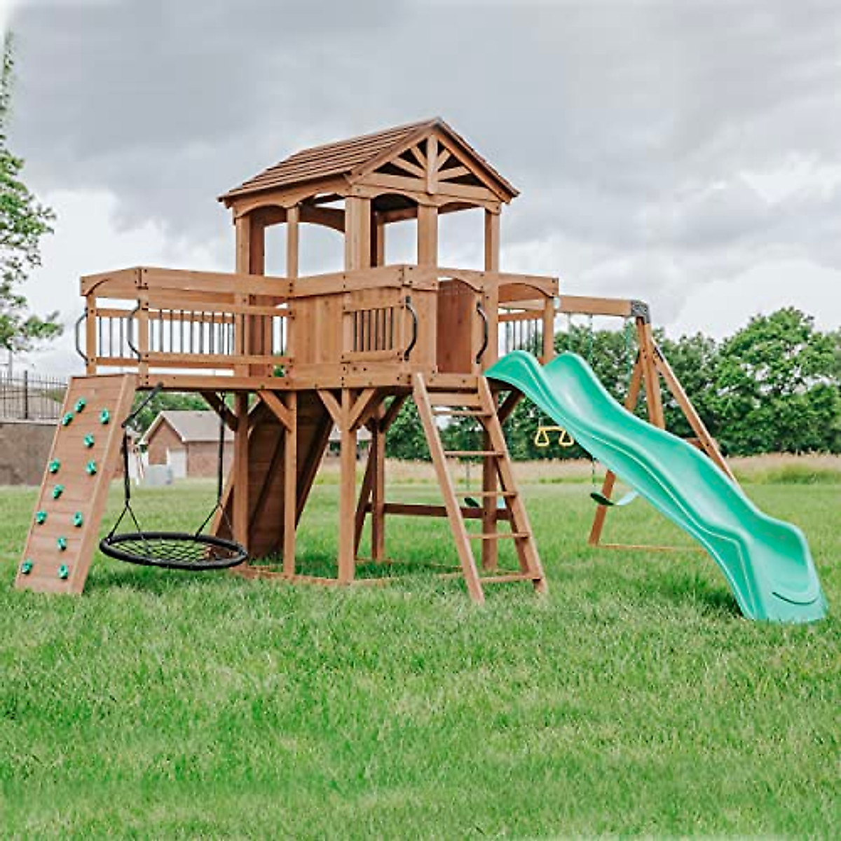 Backyard Discovery Sterling Point All Cedar Wooden Swing Set, Raised Clubhouse,Web Swing, Climbing Wall, 10ft Wave Slide, 2 Belt Swings, Front Porch, Bridge