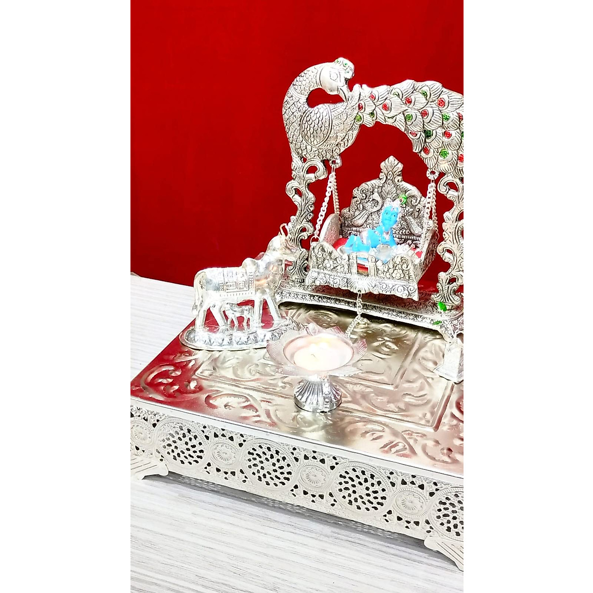 Crafting with Love a Beautiful Little Krishna Peacock jhula with German Silver chowki + Cow Calf + tulsi Plant + Lotus Handle Diya