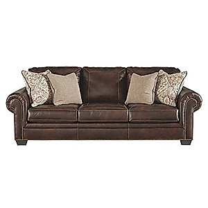 Signature Design by Ashley Roleson Traditional Leather Queen Sofa Sleeper with Nailhead Trim and 4 Accent Pillows, Brown