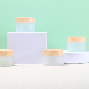 4 Pack 1oz Frosted Glass Cosmetic Cream Jar Bottle Refillable Glass Face Cream Pot Cosmetics Container With Plastic Wood grain lids and Inner Liners For Face Cream Eye Cream Lip Balm Ointments Salves