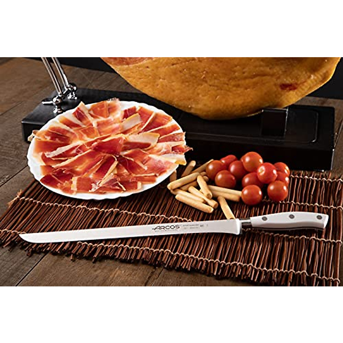 ARCOS Forged Slicing Knife / Ham Knife 12 Inch Nitrum Stainless Steel and 300 mm blade. Ergonomic Polyoxymethylene POM Handle. Series Riviera Blanc. Thin blade with a characteristic smooth edge. Color White.
