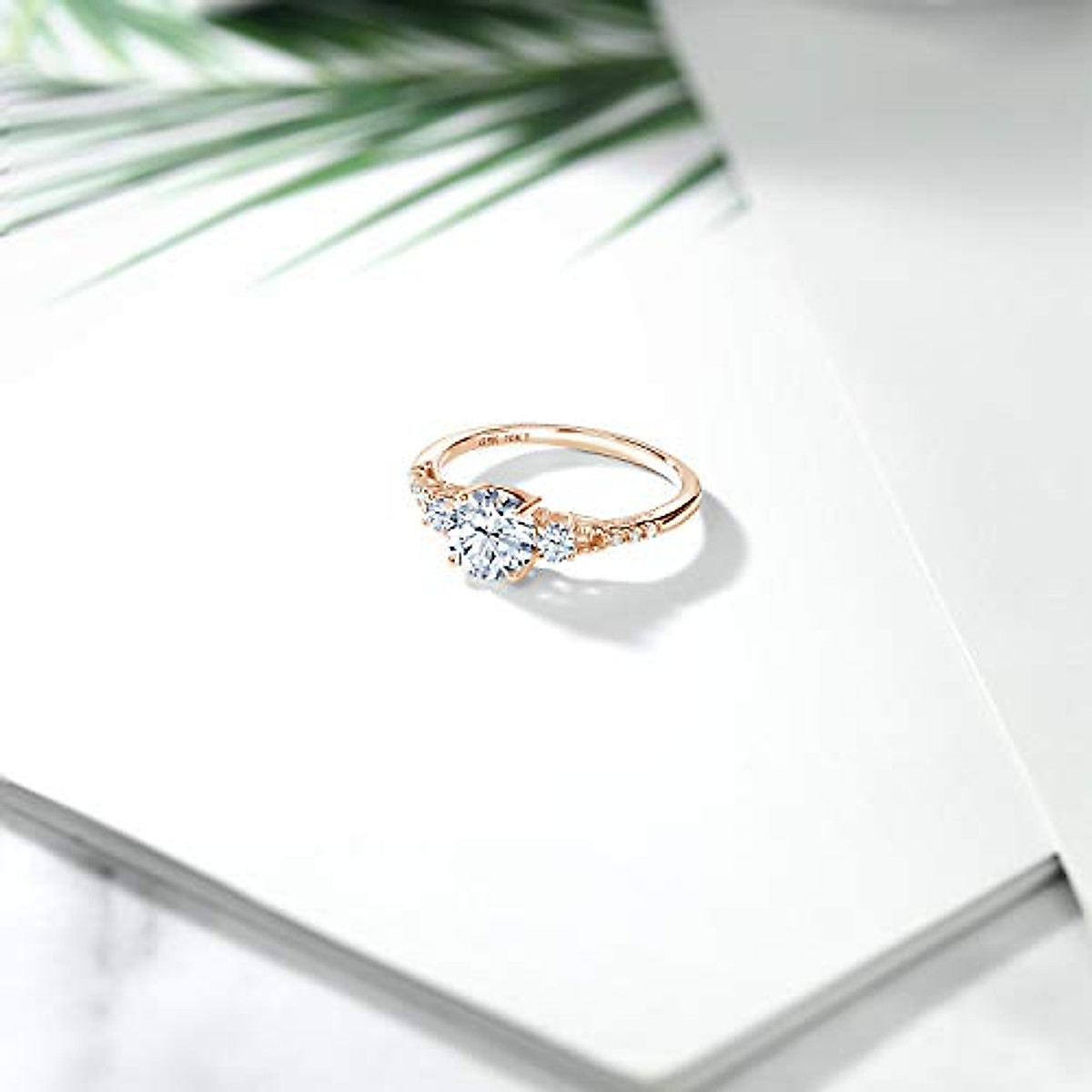 Gem Stone King 10K Rose Gold 6MM Round Gemstone Birthstone White Created Sapphire and White Diamond Accent 3-Stone Engagement Ring | Three-Stone Wedding Anniversary Promise Ring For Women