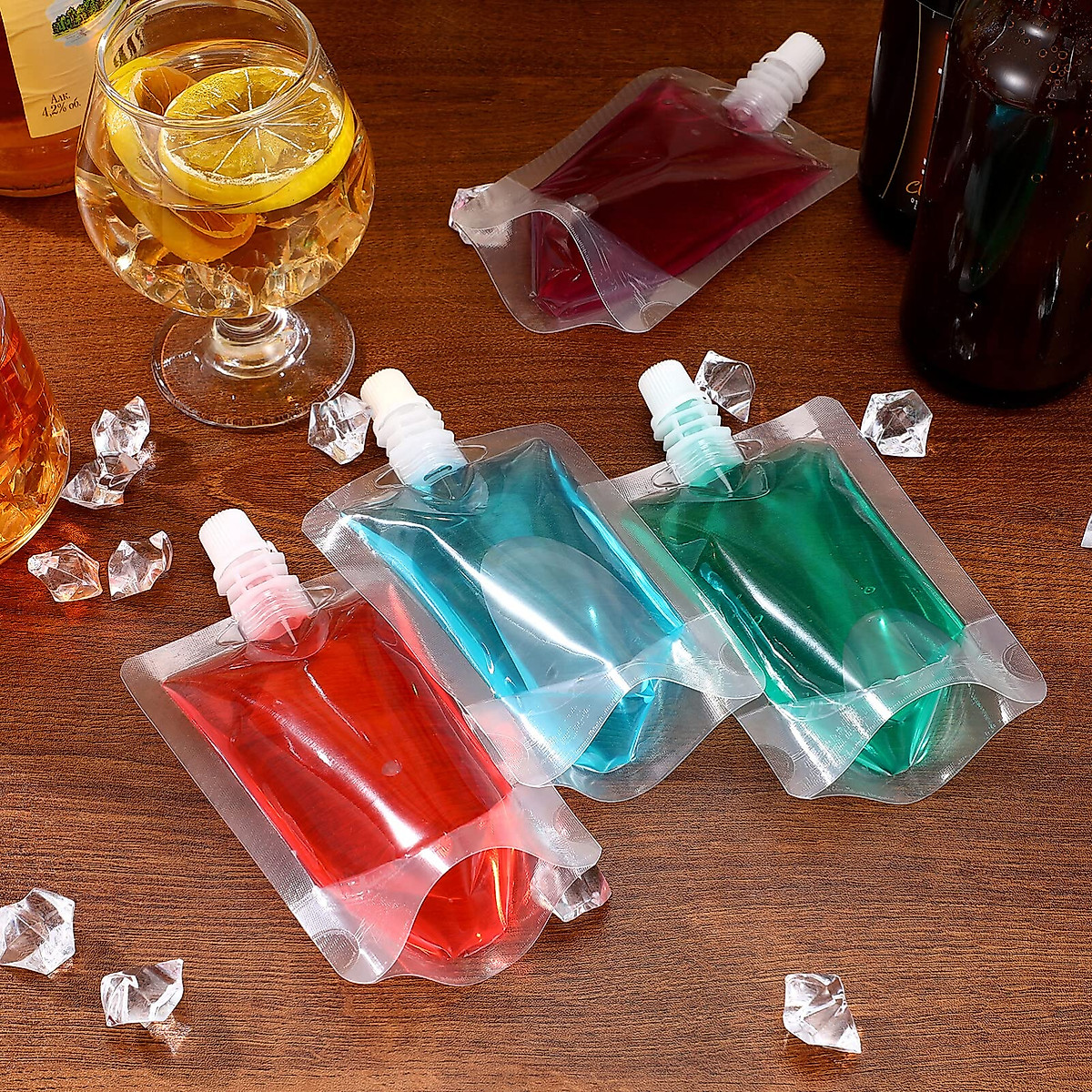 Angoily 50 Pcs Drink Bags 100ml Plastic Drink Pouches with Plastic Nozzle Clear Beverage Pouches with Nozzle Cap Leek Proof Beverage Juice Pouches for Travel Outdoor Sports Concerts Events