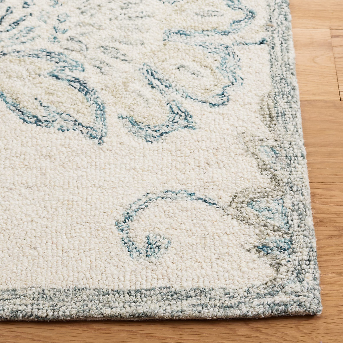 SAFAVIEH Micro-Loop Collection Area Rug - 5' x 8', Ivory & Blue, Handmade Floral Wool, Ideal for High Traffic Areas in Living Room, Bedroom (MLP477A)