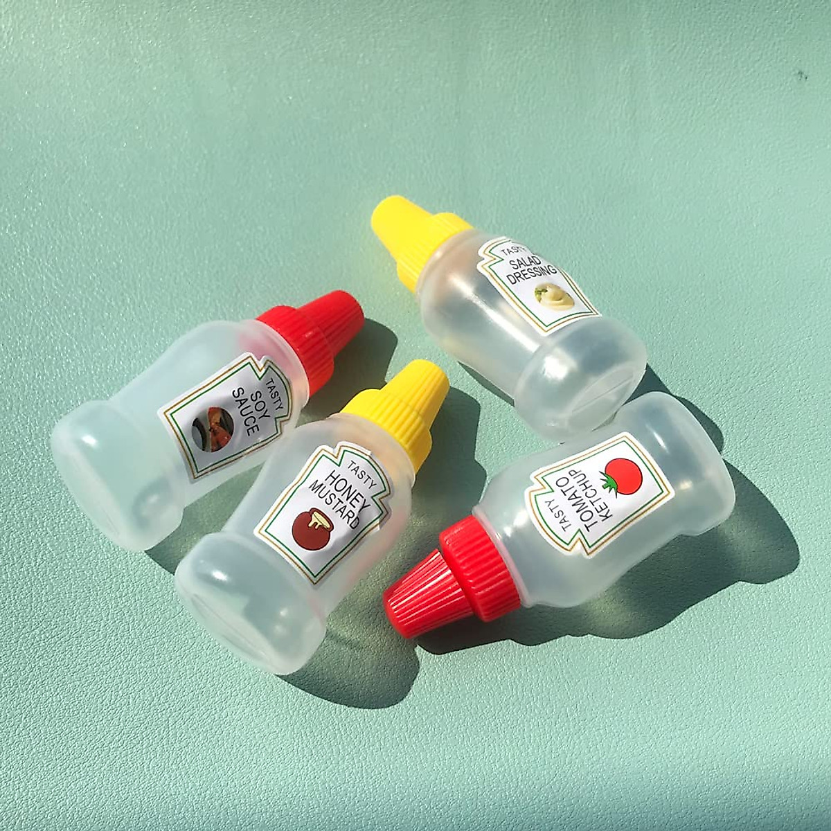 ZAYOIZY 4pcs Mini Condiment Squeeze Bottles 25ml Honey/Ketchup/Soy Sauce/Salad Dressing Dispensers Squeezable Jars Containers Plastic Portable Lunchbox with Sturdy Screw Cap