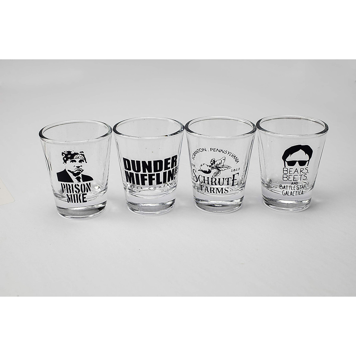 The Office 4 Piece Shot Glass Set (Dunder Mifflin, Prison Mike, Schrute Farms, and Bears, Beets, Battlestar Galactica))