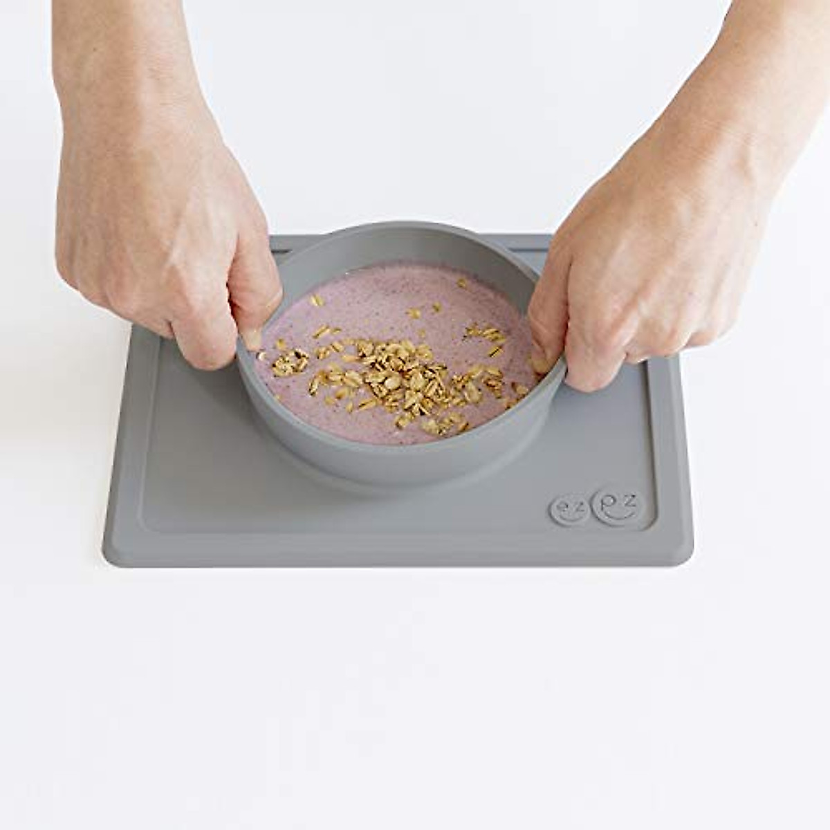 ezpz Mini Bowl - 100% Silicone Suction Bowl with Built-in Placemat for Infants + Toddlers - Comes with a Reusable Travel Bag (Gray)