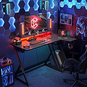 CubiCubi Gaming Desk with LED Lights & Power Outlets, 47 Inch L Shaped Carbon Fiber Surface Desk with Storage Shelves, Small Corner Computer Desk with Monitor Shelf, Black