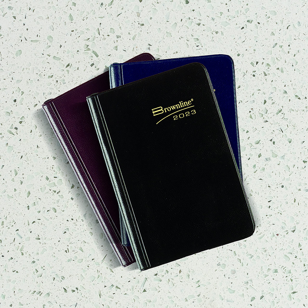 Brownline 2023 Essential Weekly Pocket Planner, 12 Months, January to December, Perfect Binding, 4" x 2.625", Assorted Colors (CB404.ASX-23)