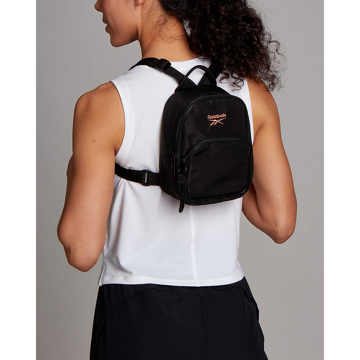 Reebok Women's Backpack - Lightweight Mini Essential Backpack - Small Casual Travel Bag, Black With Rose Gold Logo