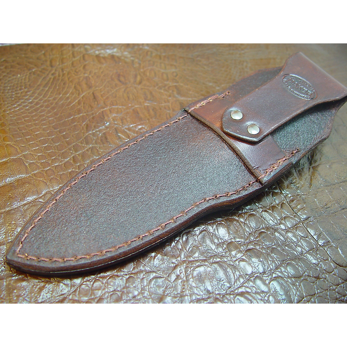 by Carl Thomas Jr. Custom Leather Knife Sheath That Fits a Buck 692 Vanguard or Zipper. Tooled and Dyed Dark Brown.
