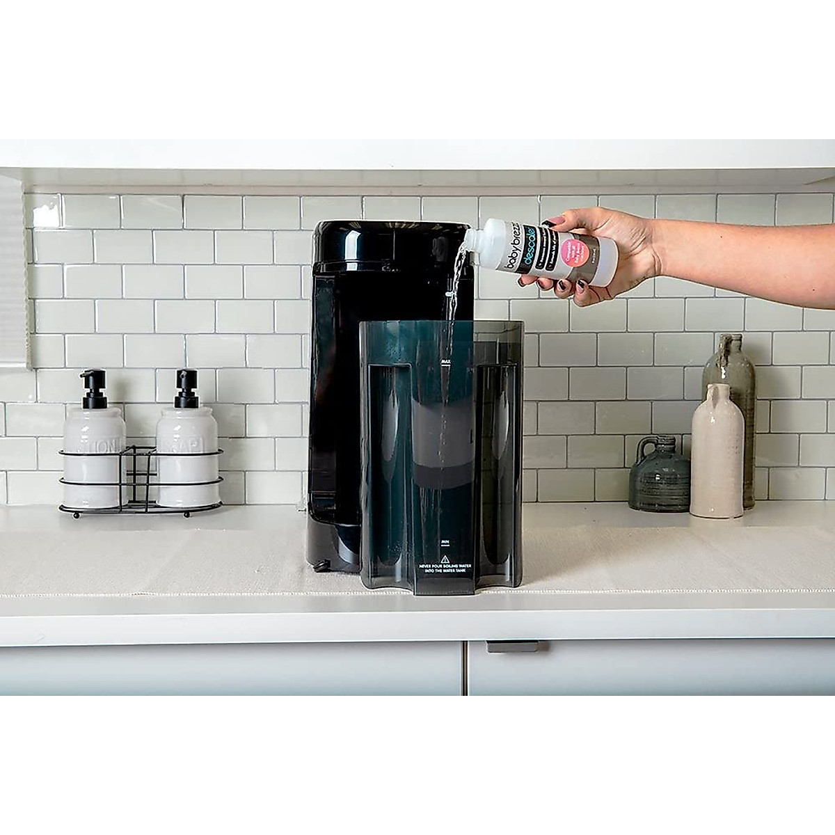 Baby Brezza Descaler 8 oz. Made in USA. Universal Descaling Solution for Baby Brezza and other baby appliances. Removes mineral build-up and extends your machine’s lifespan.