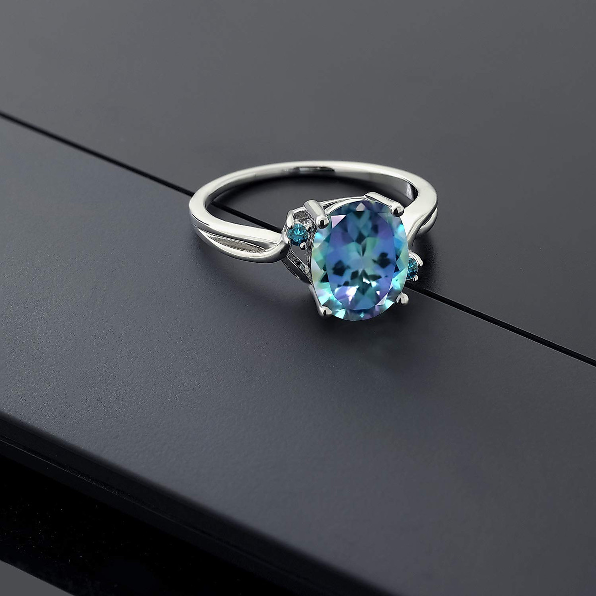 Gem Stone King 925 Sterling Silver Millennium Blue Mystic Topaz and Blue Diamond 3 Stone Ring For Women (3.03 Cttw, Oval 10X8MM, Gemstone Birthstone, Available In Size 5, 6, 7, 8, 9)
