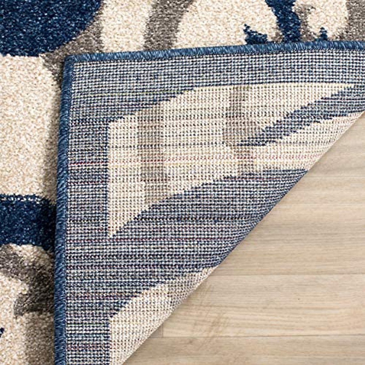 SAFAVIEH Amherst Collection Area Rug - 5'3" x 8', Ivory & Navy, Floral Scroll Design, Non-Shedding & Easy Care, Ideal for High Traffic Areas in Living Room, Bedroom (AMT428M)