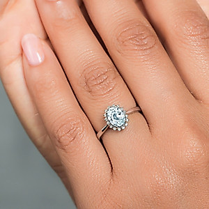 Gem Stone King 10K White Gold Sky Blue Aquamarine and Diamond Halo Engagement Ring For Women (1.25 Cttw, Oval 8X6MM, Size 9)