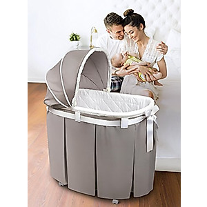 Wishes Oval Rocking Baby Bassinet with Bedding, Storage, and Pad