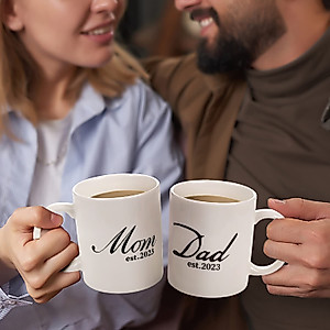 Pregnancy Gifts for First Time Moms – Mom and Dad Est 2023 11 oz Mug Set with Romper (0-3 Months) and Baby Socks ​- Top New Parents Gifts for Mom and Dad to Be