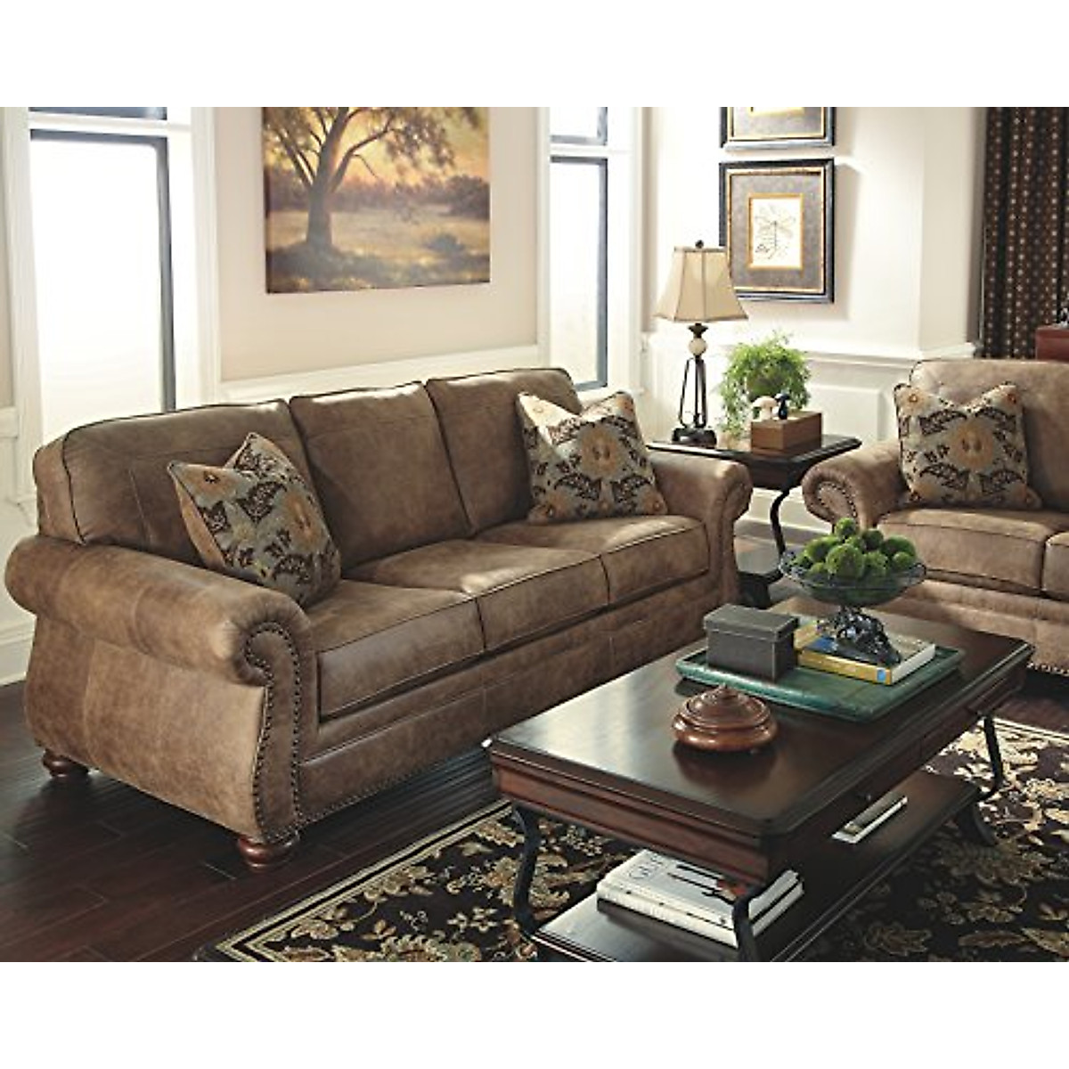 Signature Design by Ashley Larkinhurst Faux Leather Sofa with Nailhead Trim and 2 Accent Pillows, Brown