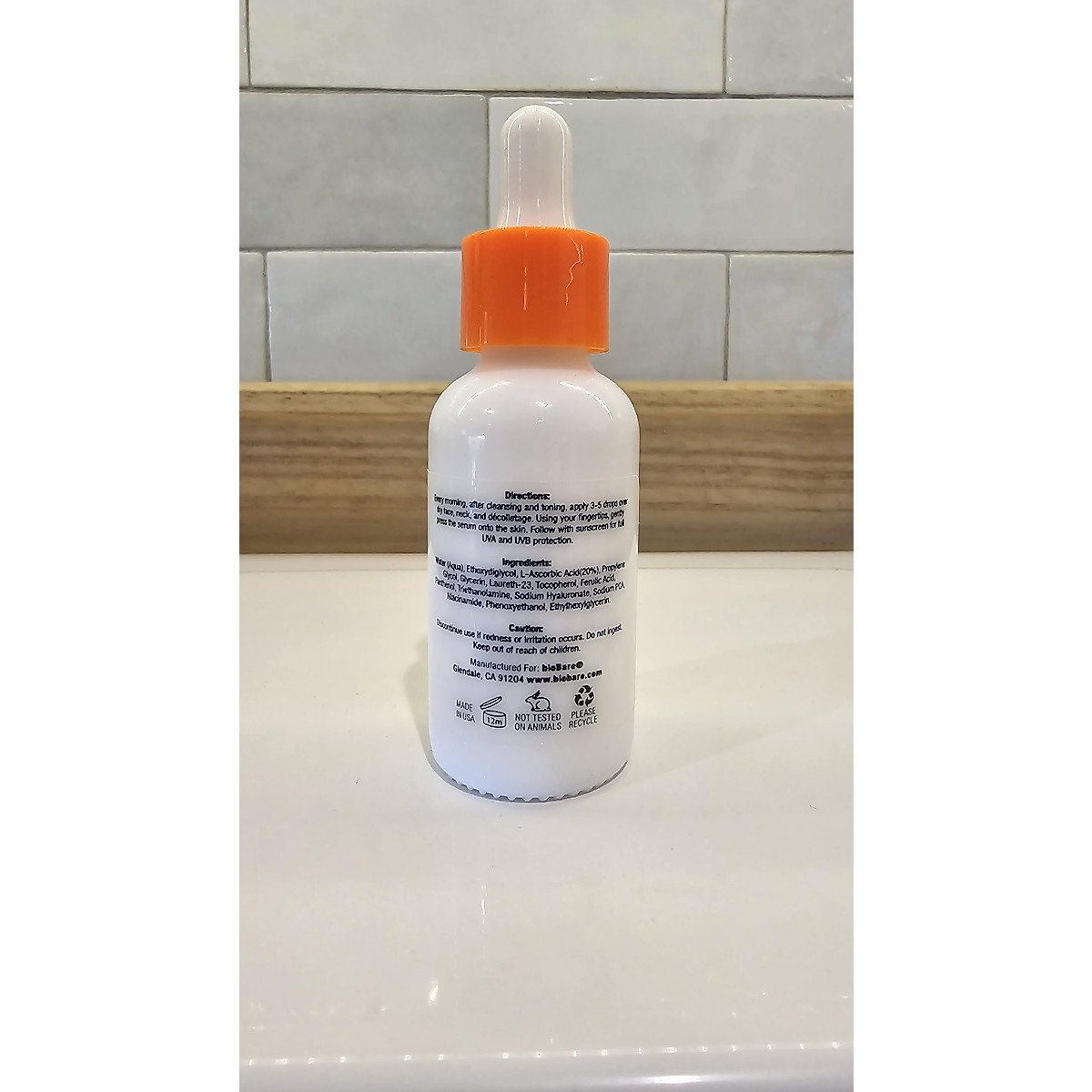 Vitamin C B E, and Ferulic Serum For Face By BioBare | 20% Pure Vitamin C W/Hyaluronic Acid | Helps Keep Skin Young, Moist, Bright & Glowing | Helps With Fine Lines, Wrinkles, Dark Spots | 1Fl Oz