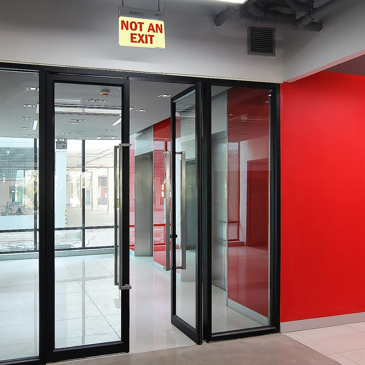 SmartSign Not an Exit Label | 7" x 10" Glow-in-The-Dark Laminated Vinyl Sticker, Made in USA