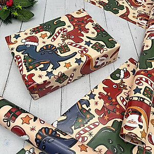 Dtiafu Dinosaur Wrapping Paper For Boys Girls Kids - 8 Sheets Dino Christmas Gift Wrap with Santa Candy Cane Joy for Birthday Wedding Holiday - Cute Cream Wrapping Paper - 20 x 28 Inch Per Sheet…