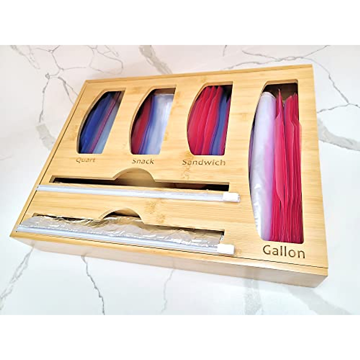 Redesigned and OVERSIZED ZipLock Bag storage organizer with plastic wrap and aluminum foil dispenser with cutter. 4 slots - Quart, Sandwich, Freezer and Gallon size.