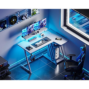 MOTPK White Gaming Desk L Shaped with LED Lights, Small Corner Computer Desk 39inch with Power Outlets, Gaming Table with PC Storage Shelf, Gamer Desk with Monitor Shelf, Carbon Fiber Texture