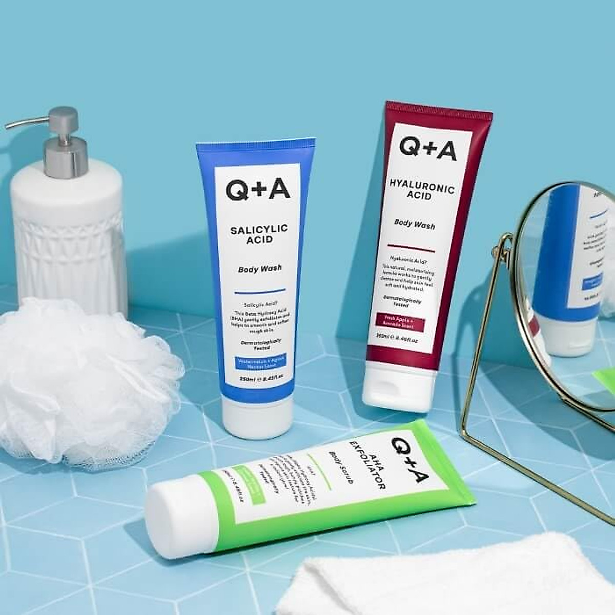 Q+A AHA Exfoliator Body Scrub, blend of AHA’s Lactic Acid and Glycolic Acid combined with exfoliants, improves skin texture and promotes soft and supple skin, 250ml