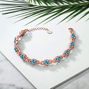 Gem Stone King 18K Rose Gold Plated Silver Oval Swiss Blue Topaz Tennis Bracelet For Women (9.65 Cttw, Gemstone Birthstone, 7 Inch With 1 Inch Extender)