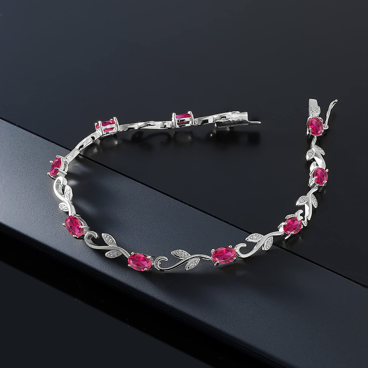 Gem Stone King 925 Sterling Silver Red Created Ruby and White Diamond Greek Vine Tennis Bracelet For Women (4.63 Cttw, Oval 6X4MM, 7 Inch)