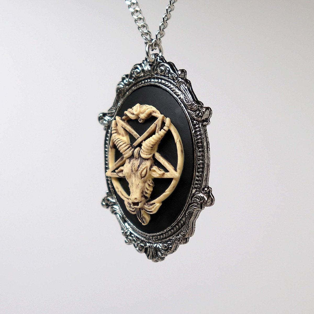 Antiqued Goat Head Satanic Baphomet Cameo Bone on Black In Silver Finish Frame Pendant Necklace