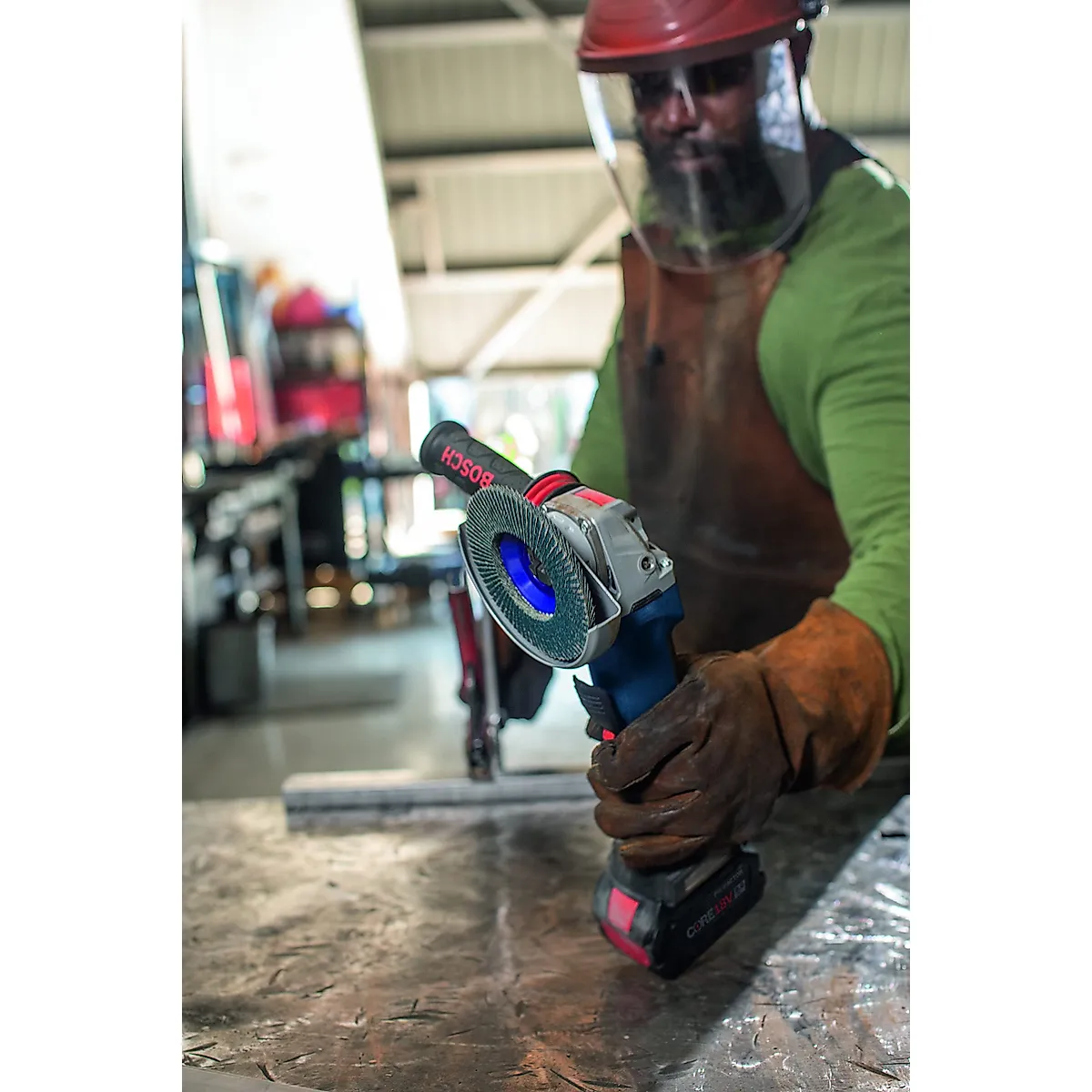 Bosch GWX10-45PE 4-1/2 In. X-LOCK Ergonomic Angle Grinder with Paddle Switch with Bosch FDX2745080 4-1/2 In. X-LOCK Arbor Type 27 80 Grit Flap Disc