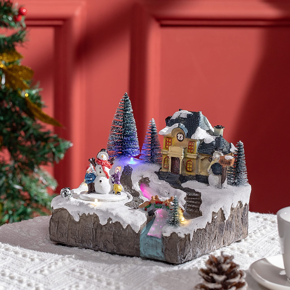 HOMCOM Christmas Village Rotating Skating Pond Animated Winter Wonderland Set with LED Light, Music, Fiber Optic, Battery-Operated Christmas Decoration