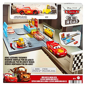 Disney and Pixar Cars On The Road Dinoco Rusteze Racing Center Playset with Lightning McQueen Toy Car, Launcher, Short Track and Spinning Pitty, Toy Gift for Kids, HGV69