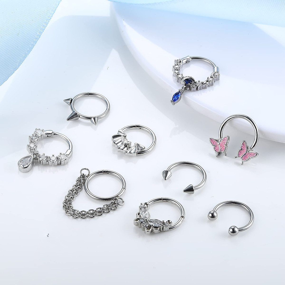 Sanfenly 9Pcs 16G Septum Rings for Women Men Stainless Steel Dangle Septum Jewelry Blue Planet Teardrop CZ Butterfly Bat Spiked Daith Earrings Hoop Nose Rings Cartilage Helix Septum Piercing Jewelry