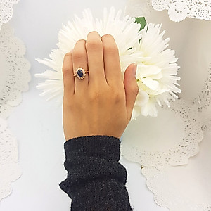 Dazzlingrock Collection 7x5mm Oval Blue Sapphire & Round White Diamond Halo Style Engagement Ring For Women in 14K Solid Rose Gold Size 10