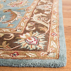SAFAVIEH Heritage Collection Area Rug - 8'3" x 11', Blue & Brown, Handmade Traditional Oriental Wool, Ideal for High Traffic Areas in Living Room, Bedroom (HG812B)