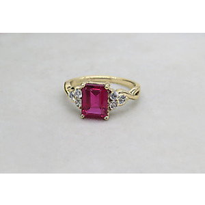 Dazzlingrock Collection 8x6mm Emerald Shape Center Lab Created Ruby & 2.2mm Round White Sapphire on Side Crisscross Shank Engagement Ring for Her in 10K Yellow Gold Size 7