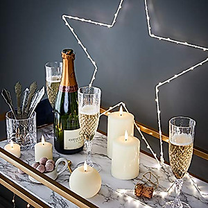 Lights4fun, Inc. Set of 4 TruGlow Ivory Distressed Wax Flameless LED Battery Operated Sphere Candles with Remote Control