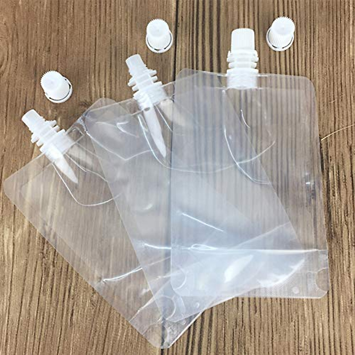 100Pcs Drink Pouches, Drinks Flasks Liquor Pouch Sealing Storage Packaging Bag, Disposable Milk Stand Up with Nozzle, Transparent Drinks Pouch 100 ml/200 ml/250 ml/300 ml