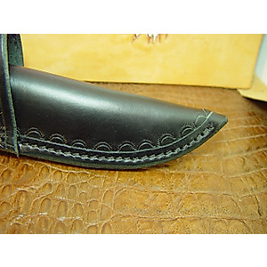 Custom cross draw knife sheath for the buck Selkirk knife. The sheath is made out of water buffalo hide leather Black.