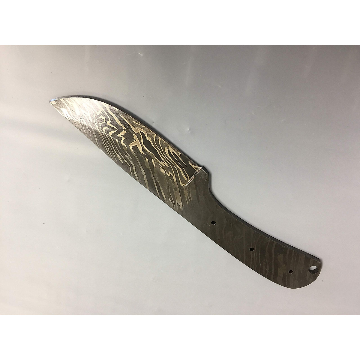 8.5 inches long hand forged Twist pattern Damascus steel trailing point blank blade skinning knife with 3 Pin hole & an inserting hole space 4 inches cutting edge