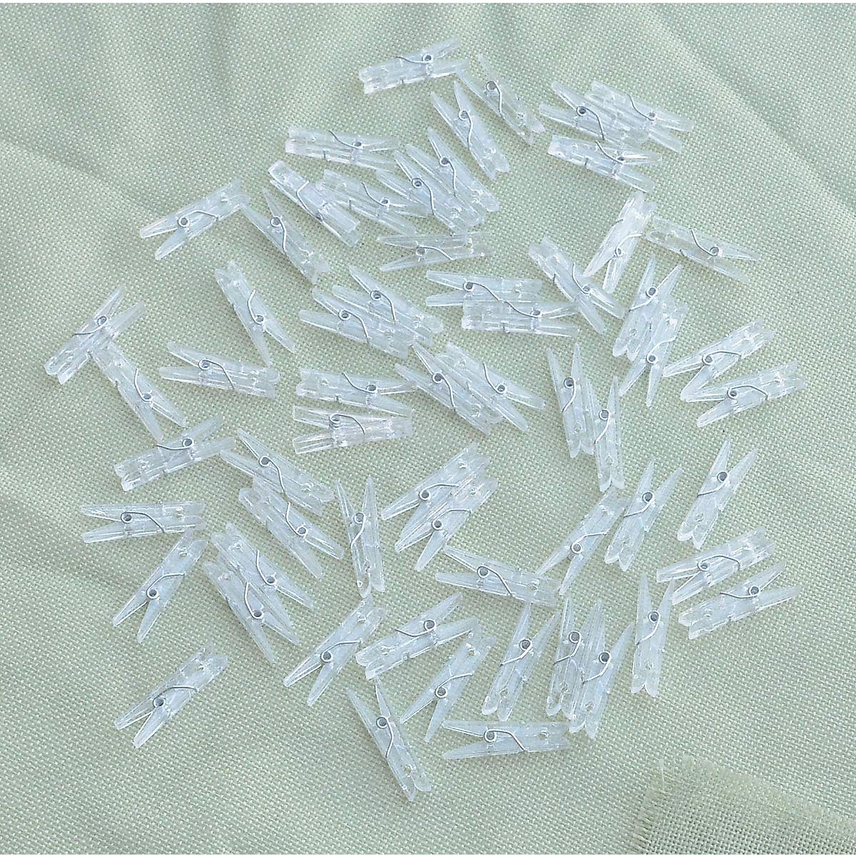 Yansanido 100pcs Mini Clear Plastic Utility Paper Clip, Clothespins Clips, Clothes Line String Clips, Mini Clothes Pins for Photo for String Fairy Lights Color Clear(100pcs Clear Plastic Clips)
