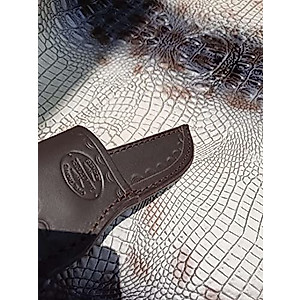 Custom Cross Draw Knife Sheath for Buck 102 Knife. The Sheath Is Made Out of 10 Ounce Water Buffalo Hide Leather the Leather Is Soft Pliable and Very Durable. This Sheath Can Be Worn on the Right or Left Hand Side. It Is Died Dark Brown with Border Toolin