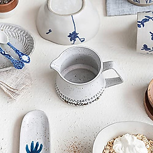 Creative Co-Op Stoneware Creamer with Debossed Pattern, Antique White and Blue Reactive Glaze, 6" L x 4" W x 4" H