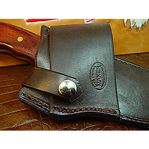 Custom-made Cross Draw Knife Sheath for the Buck Kalinga 401 Knife. The Sheath Is Made Out of 10 Ounce Water Buffalo Hide Leather. The 10 oz. Leather is Dyed Dark Brown. The Sheath Also Has a Strap for Extra Security of Your Knife From Falling Out. The Sh